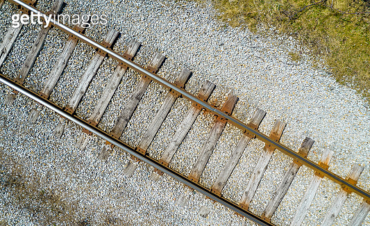 Hovering low over a railway track, bird perspective view. Railroad ...