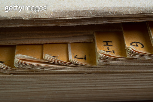 Old vintage withered English dictionary book with alphabet side view ...