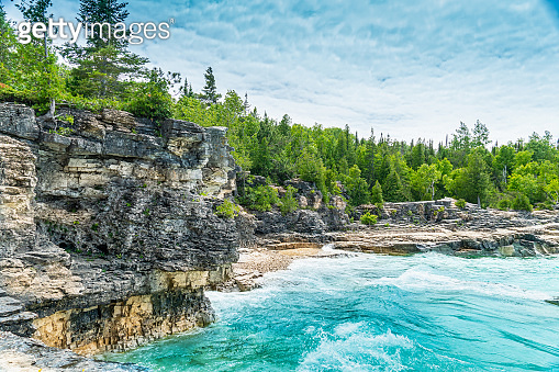 Indian Head Cove At Tobermory Turquoise Blue Water And Green Pine Forest In Ontario Canada