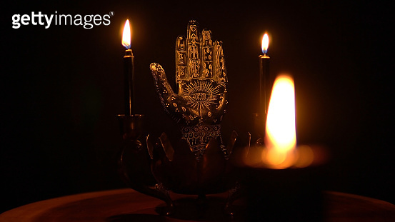 Fortune teller hand or palmistry on the witch table. Palmistry with ...