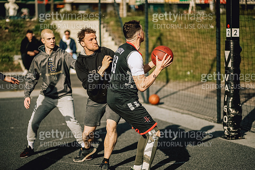 People playing streetball at the street. Sports photography with ...