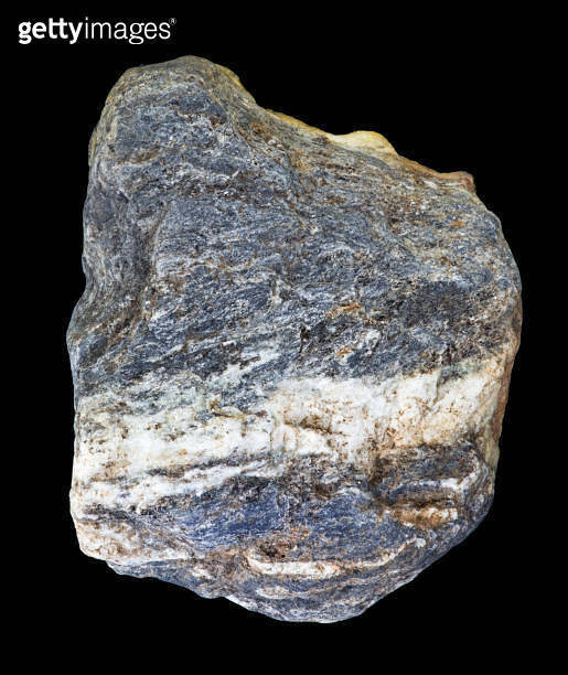 Magnified close up of metamorphic gneiss rock with quartz bands ...