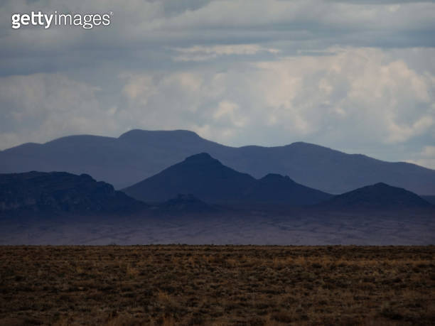 A distant series of desert mountain ranges. Basin and range topography ...