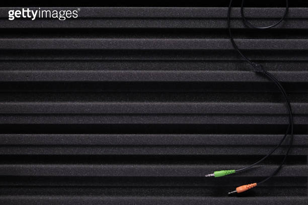 Audio jack and acoustic soundproof foam wall background texture. Sound ...