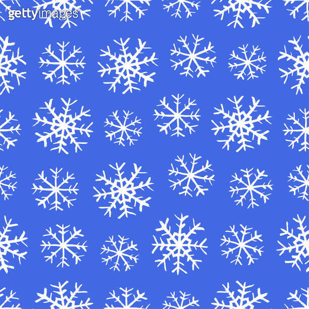 Small white ink snowflakes isolated on blue background. Cute monochrome ...