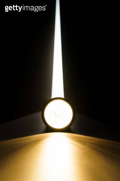 Flashlight isolated on dark background (Flashlight and a beam of light ...