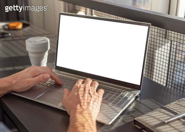 Laptop mockup with blank screen. Woman hands closeup typing on keyboard ...