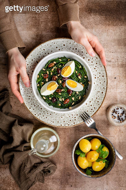 Preparing Dinner with Sauteed Agretti with Taggiasca olives, pinoli or ...