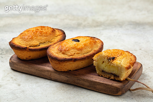 A Pasticciotto, small Italian cake, filled with egg custard cream ...