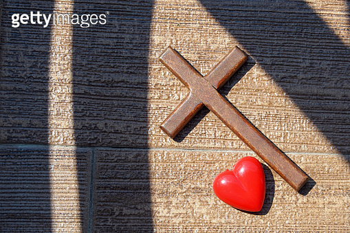 Red heart, wooden Jesus cross on tile. Concept Jesus loves you, Jesus ...