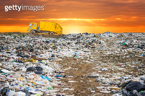 garbage dump pile in trash dump or landfill,backhoe and truck is ...