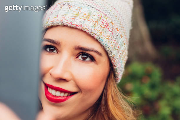 Close-up of the face of a beautiful young adult woman with blonde hair ...