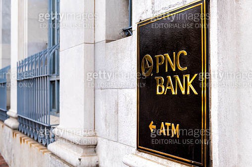 Georgetown M street with PNC bank entrance sign logo on wall closeup ...
