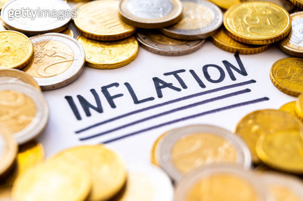 Word "inflation" and around coins. Rising prices and inflation ...