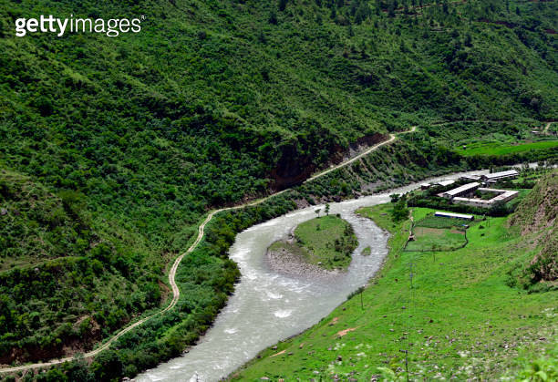 Islet on the Dang Chu river and the Rabuna Prison, Wangdue Phodrang ...