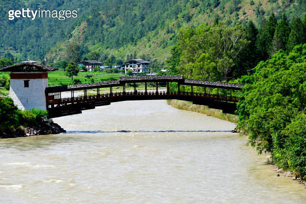 Covered wooden cantilever bridge crossing the Mo Chu river, entrance to ...
