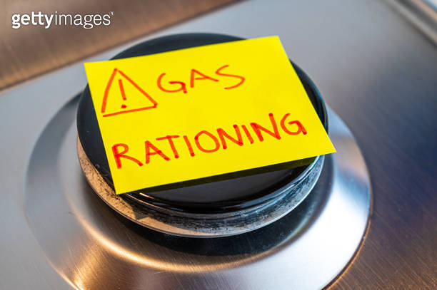 Gas stove and "gas rationing" ticket. Energy crisis and economic ...