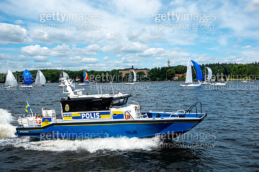 Swedish police boat traveling at speed in Stockholm archipelago ...