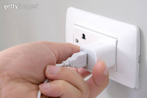 Hand of Electrical Appliances He was pulling the plug. Out of the plug ...