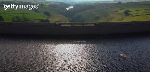 Aerial view of Baitings dam and reservoir with low water levels ...