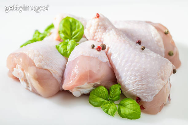 Raw uncooked chicken drumsticks. Raw butchered chicken meat with fresh ...