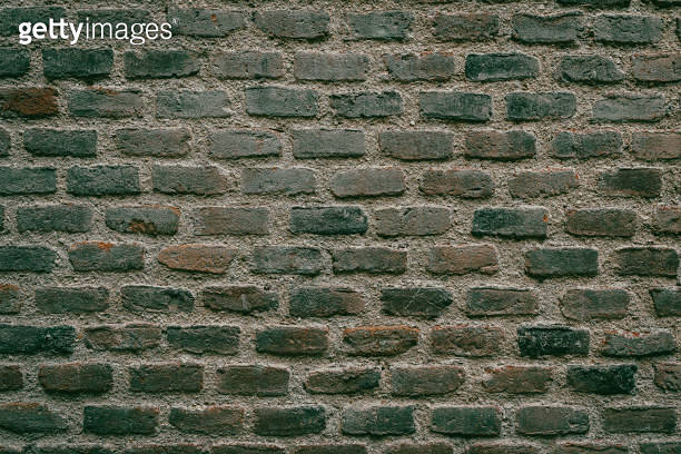 Brick wall with even rows of red and gray bricks. Brick pole texture ...