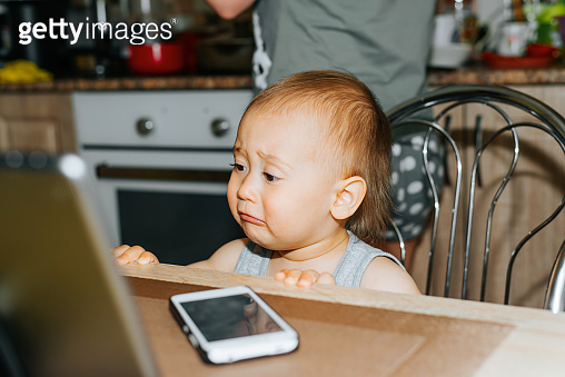 Portrait of upset crying caucasian toddler boy indoors. Sad child ...