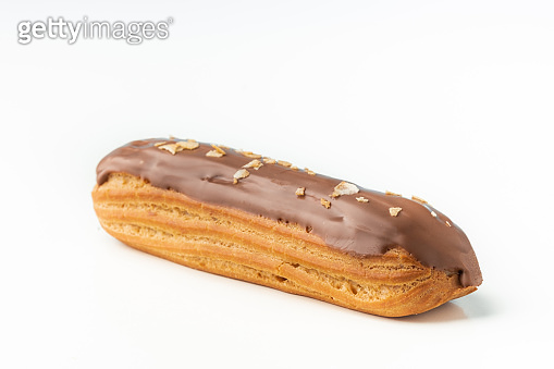 Traditional French pastry. Eclair with custard and chocolate icing ...