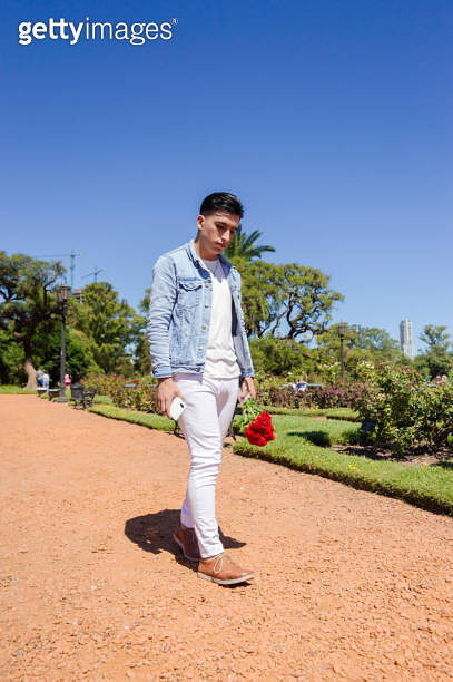 sad, jilted young man walking head down defeated by love (1368413570 ...