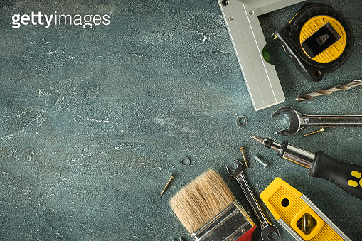 Handyman's tools. Flat lay of clamps, wrench, screwdriver, drill, angle ...