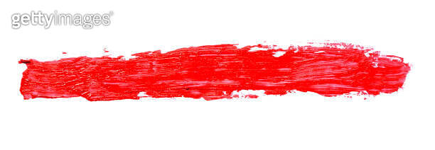Close up of red lipstick smudge or smear isolated on white background ...