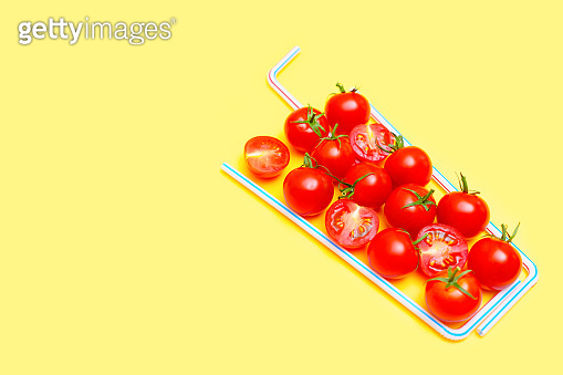 Cocktail shape made from cherry tomatoes on yellow 이미지 (1405646932 ...