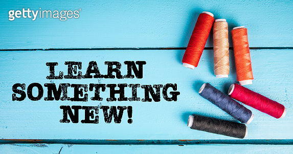 Learn something new. Text on blue wood texture background 이미지 ...