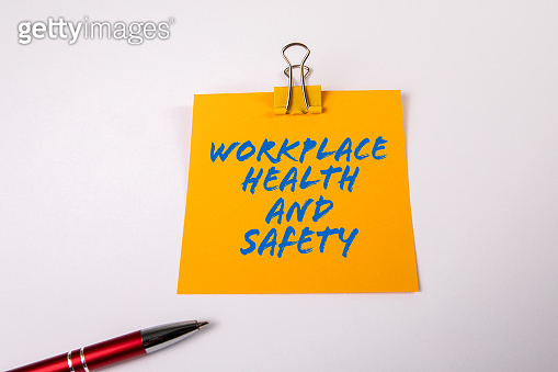 Workplace Health and Safety. Pen and sticky note on a white background ...