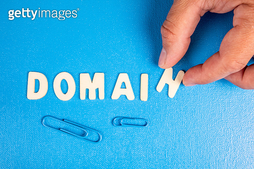Domain. Text from white wooden letters on a blue background 이미지 ...