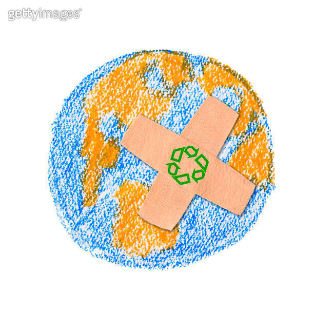 Cross shape bandages with green recycling symbol, affixed to the Earth ...