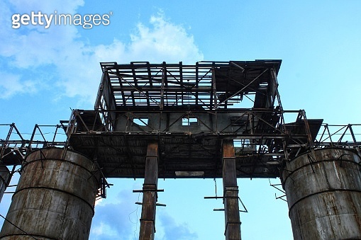 Rusty structures pipes of an old abandoned destroyed industrial steel ...