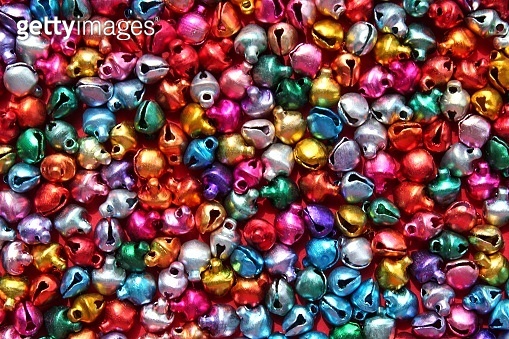Little christmas multi-colored jingle bells background with copy space ...
