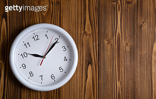 large white clock face with digits on a wooden background top view 이미지 ...