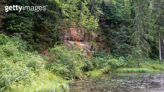 Mirror cliffs and an old river channel in a very beautiful forest in ...