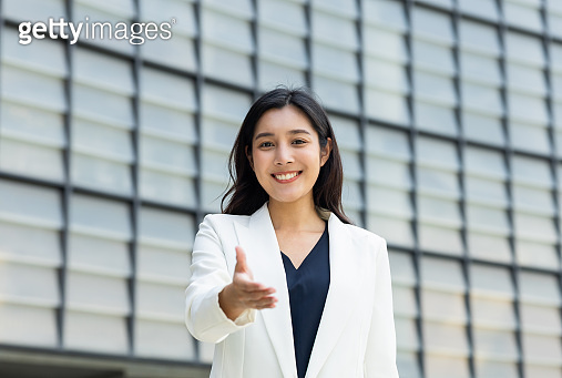 Portrait beautiful business woman shake hands and standing in the ...