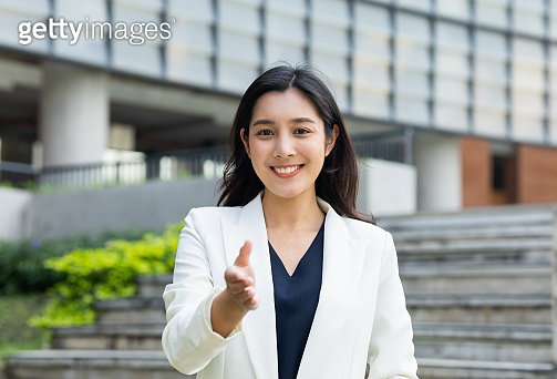Portrait beautiful business woman shake hands and standing in the ...