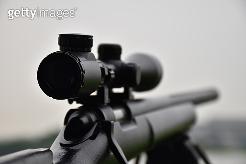 Rifle with a scope and bipod with first person shooter (FPS) view ...