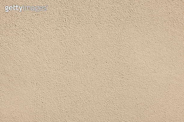 Part of an old freshly painted textured beige concrete block wall 이미지 ...