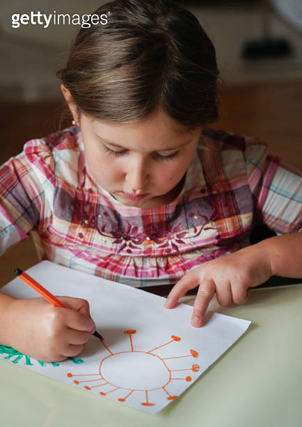 Cute little girl holds her drawing molecule Corona virus Omicron by ...
