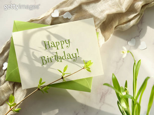 Happy Birthday card Spring background. Paper card and green envelope ...