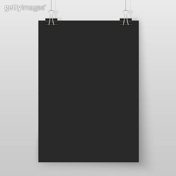 Poster on binder clips on grey wall. Rectangular black paper mock up ...