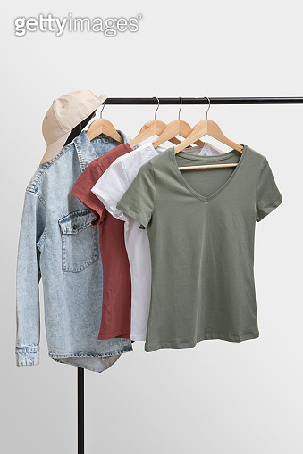 Basic women`s clothes. Woman collection of clothes on a rack. Spring ...