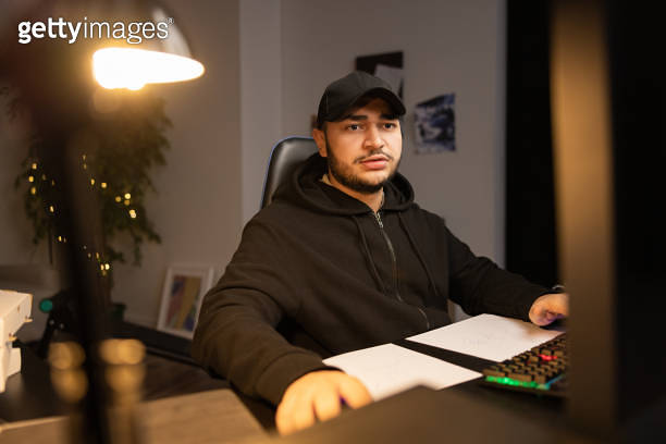 Portrait of a man addicted to computers, working remotely in IT ...