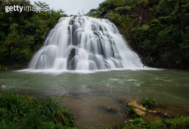 The stunning staircase Owharoa Falls are nested in the heart of the ...